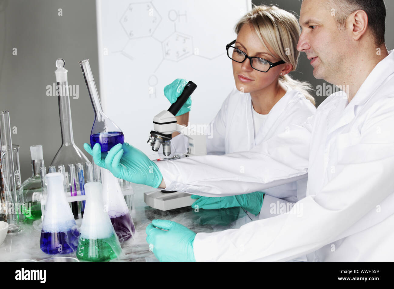 two scientist in chemical lab conducting experiments Stock Photo - Alamy