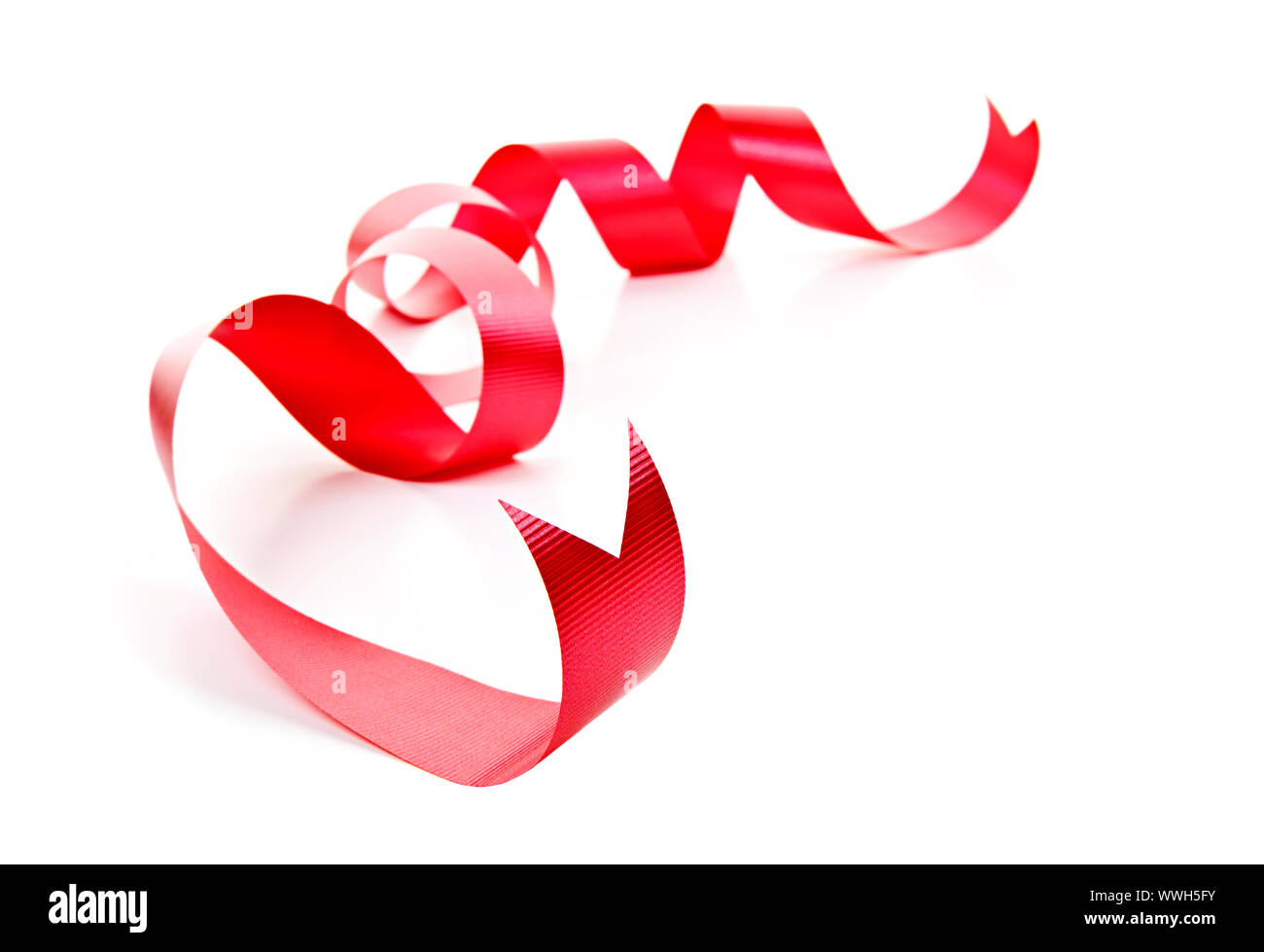 Curled red holiday ribbon strip isolated on white background Stock ...