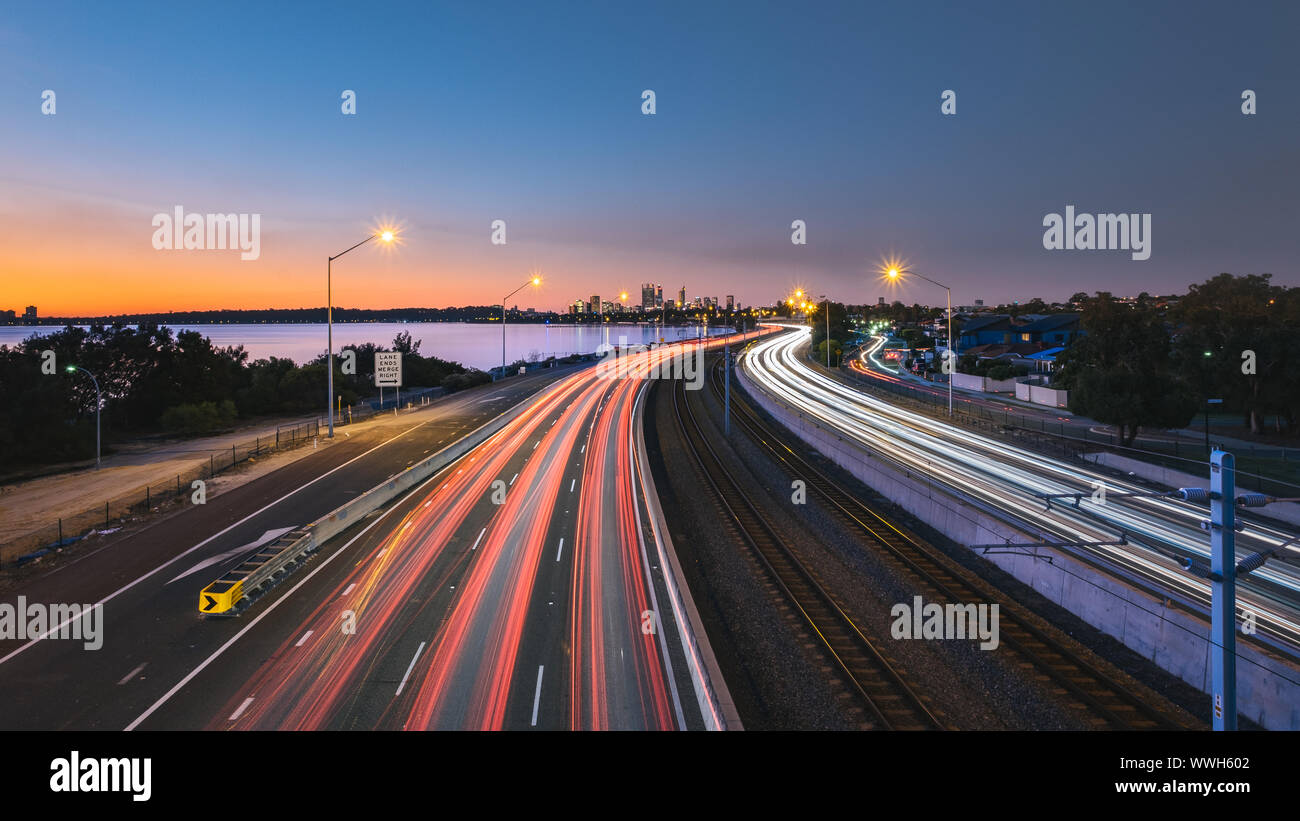 Traffic on city road during sunset in Perth, WA Australia Stock Photo ...