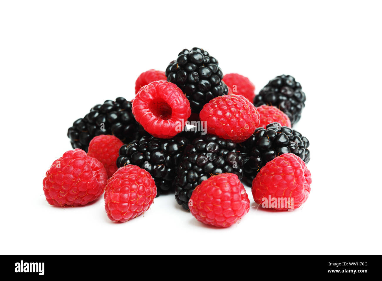 berry mixed pile on black background Stock Photo - Alamy