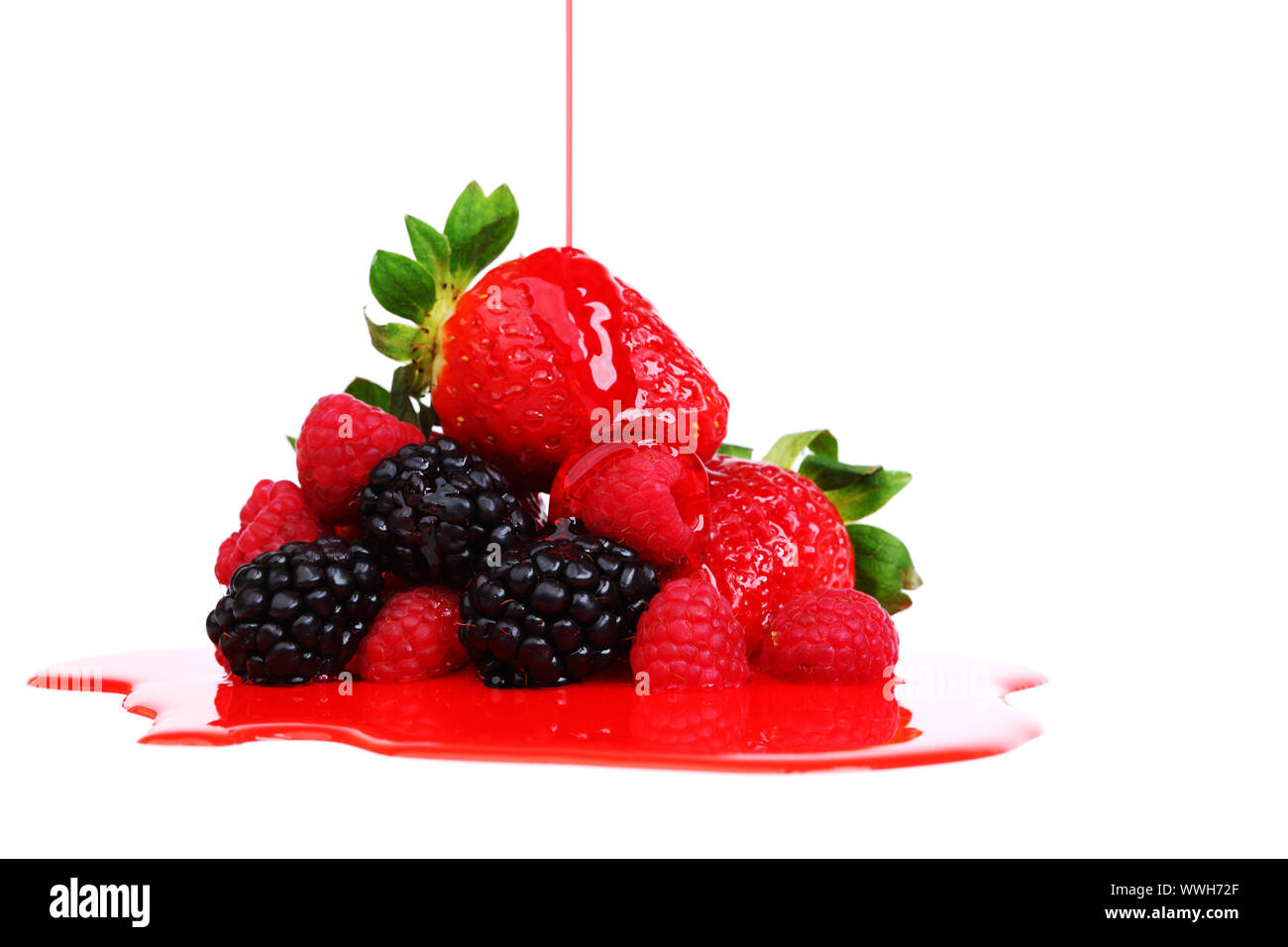 big berry pile in syrup isolated on white Stock Photo - Alamy