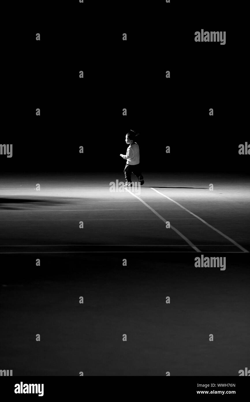 Asian boy on the playground with black and white toned Stock Photo - Alamy