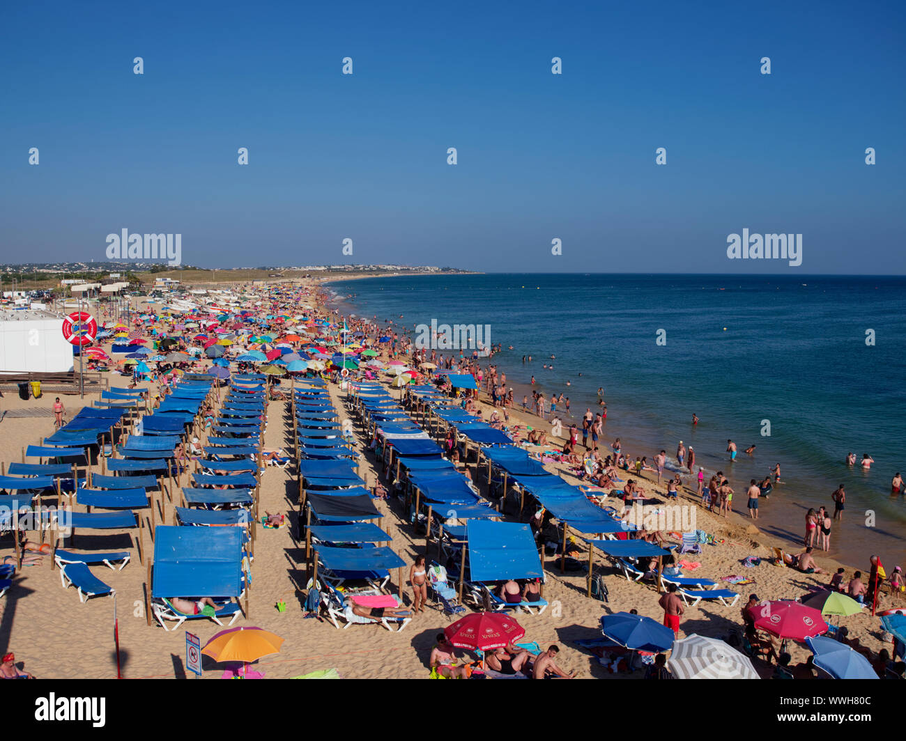 The Crowded Beach at Faro on the Algarve of Portugal on a local holiday ...