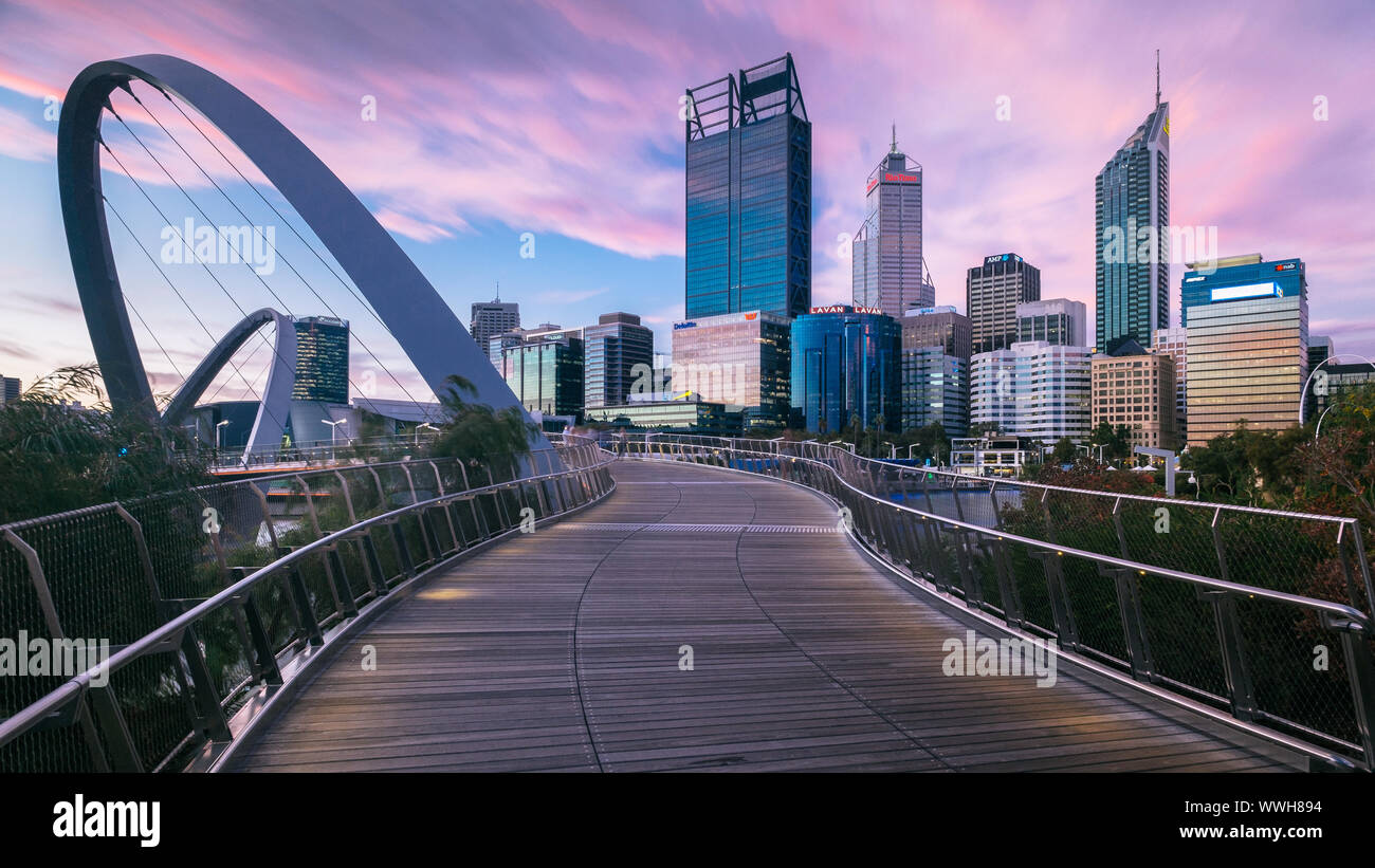 Perth CBD skyline at sunset viewed from the pedestrian bridge at ...