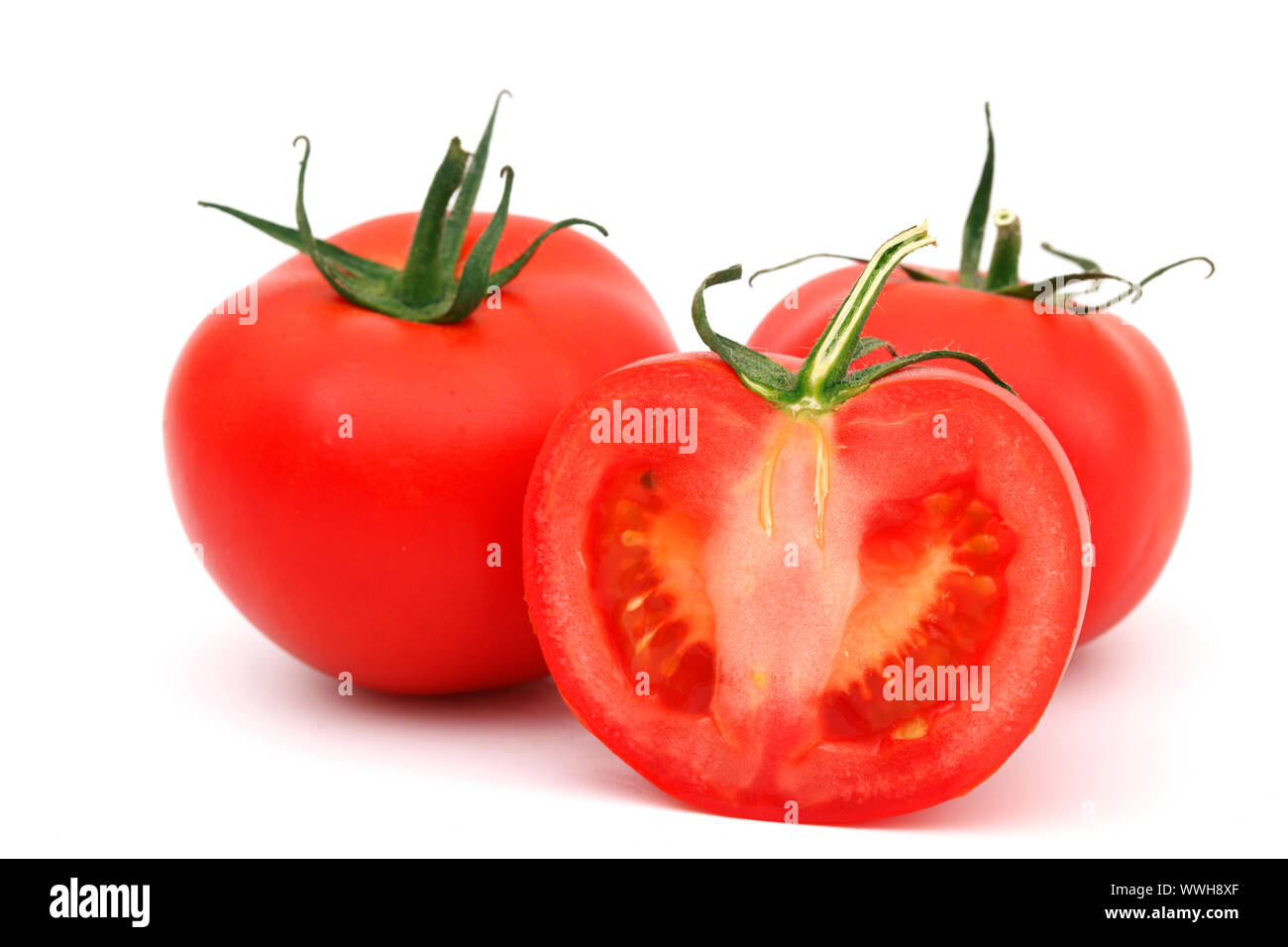 tomato pile slice isolated on white Stock Photo - Alamy