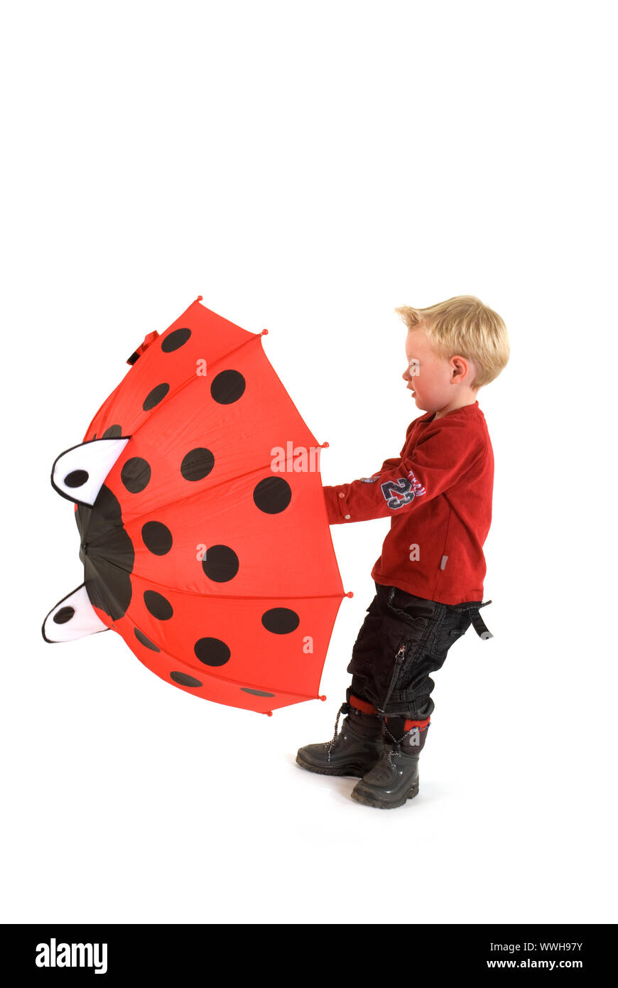 A very windy day for the little boy Stock Photo - Alamy