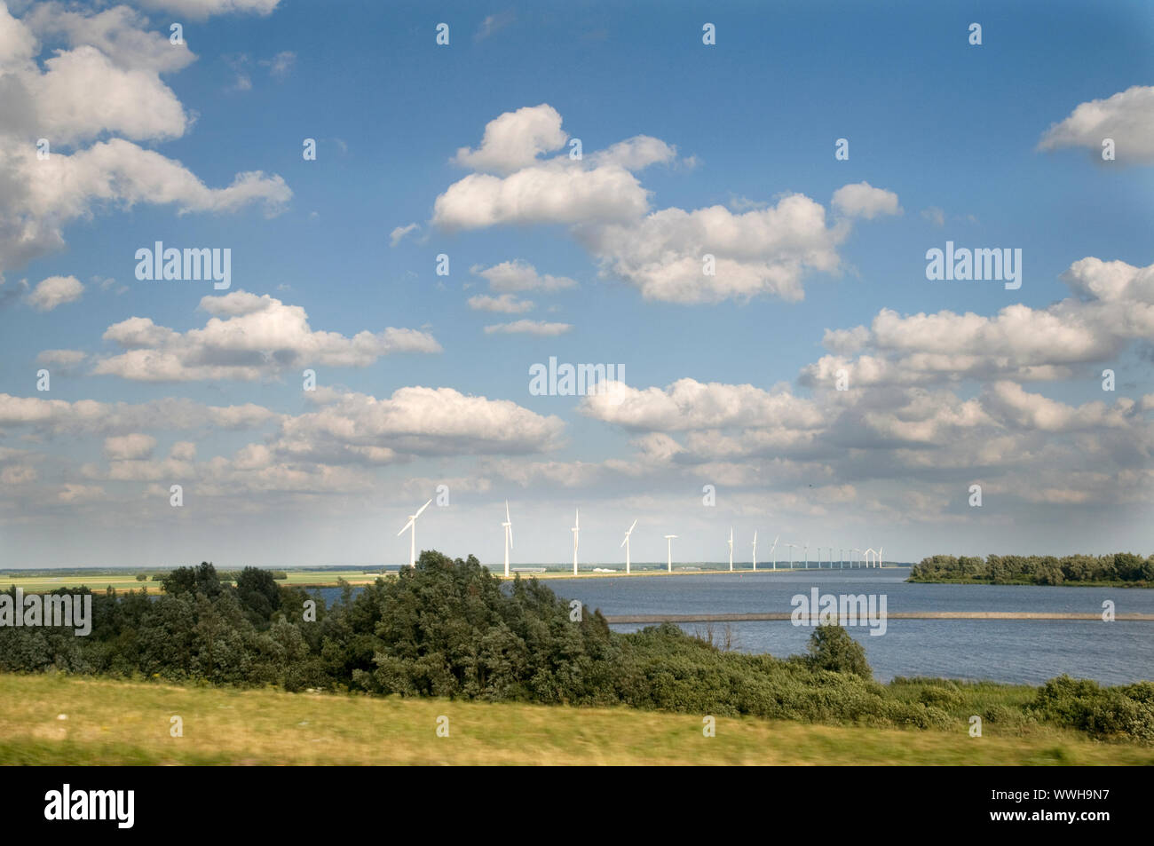 water landscape with wind mills Stock Photo - Alamy