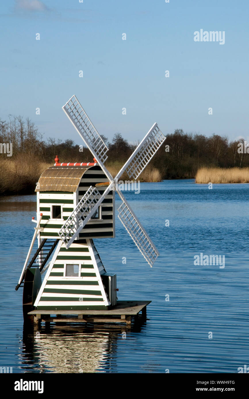 Dutch windmill in the water Stock Photo - Alamy