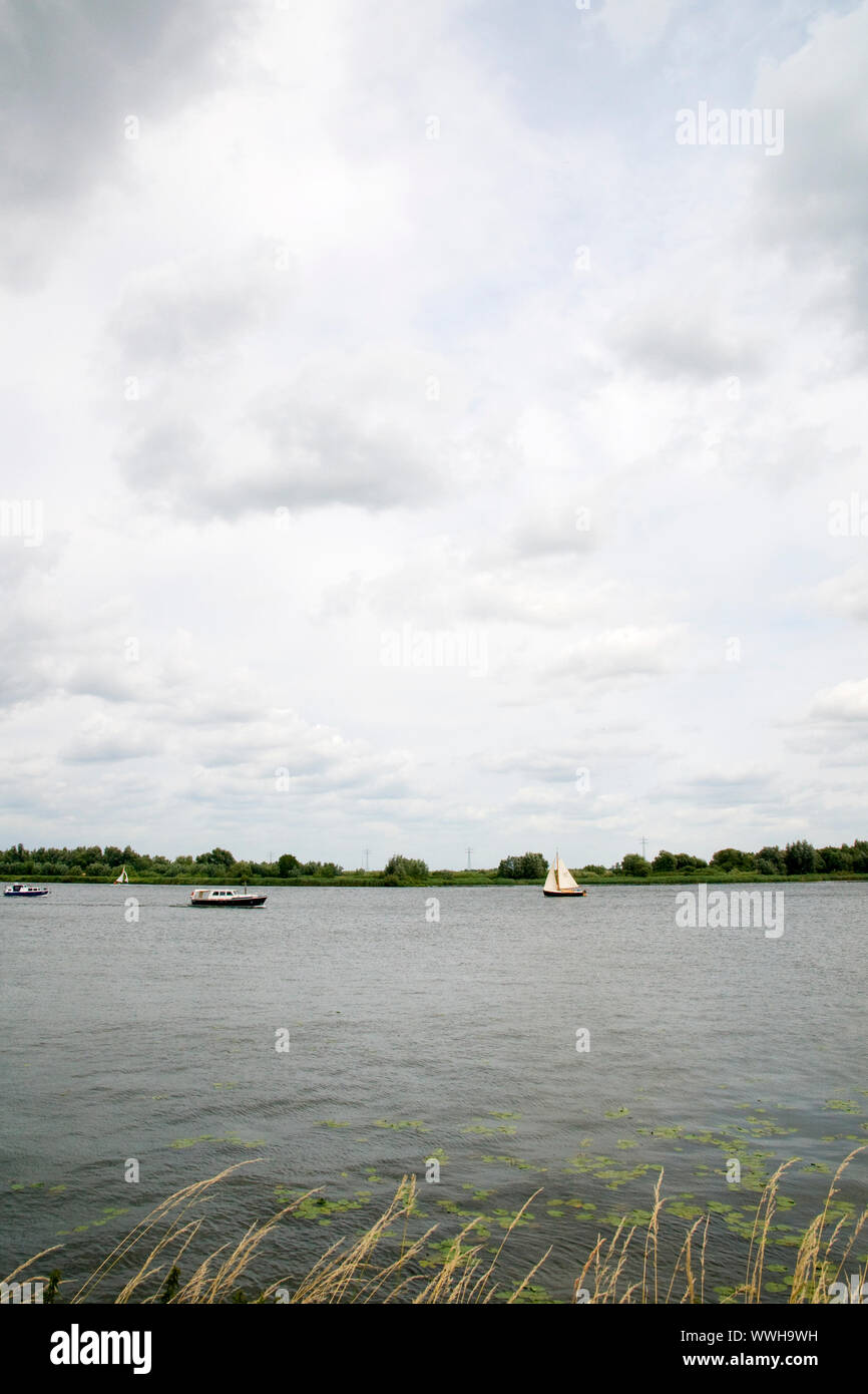 Dutch river landscape with boats Stock Photo - Alamy