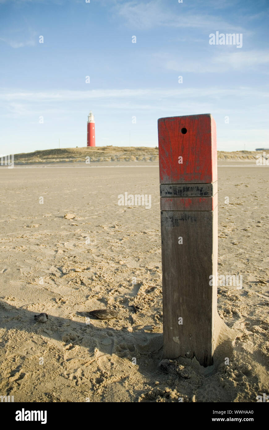 landscape at the beach with pole and lighthouse Stock Photo - Alamy