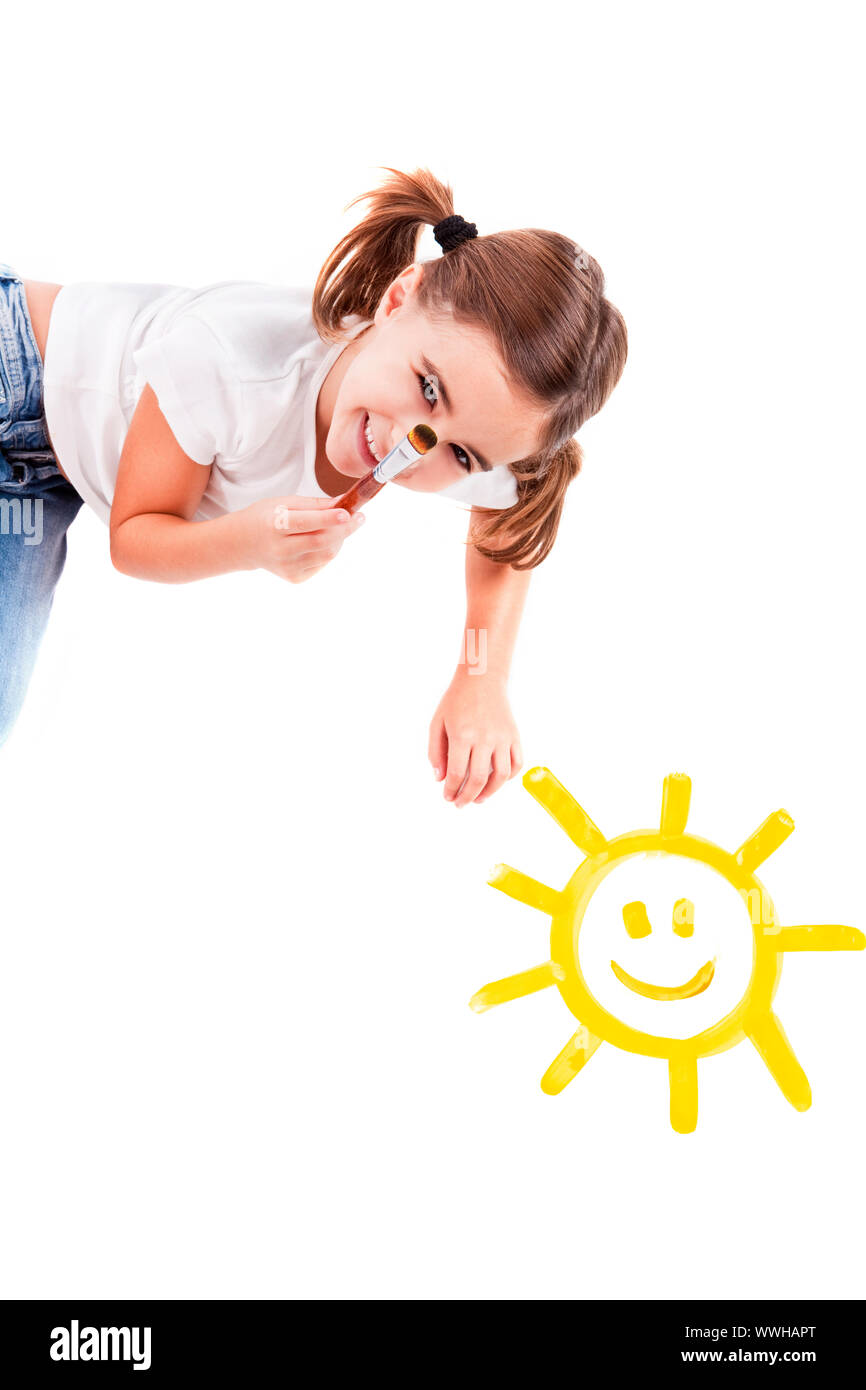 Top view of a happy girl lying on floor and painting a happy sun Stock ...