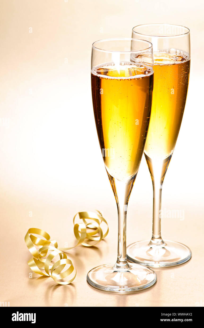 Two full champagne flutes with sparkling wine and ribbon Stock Photo ...