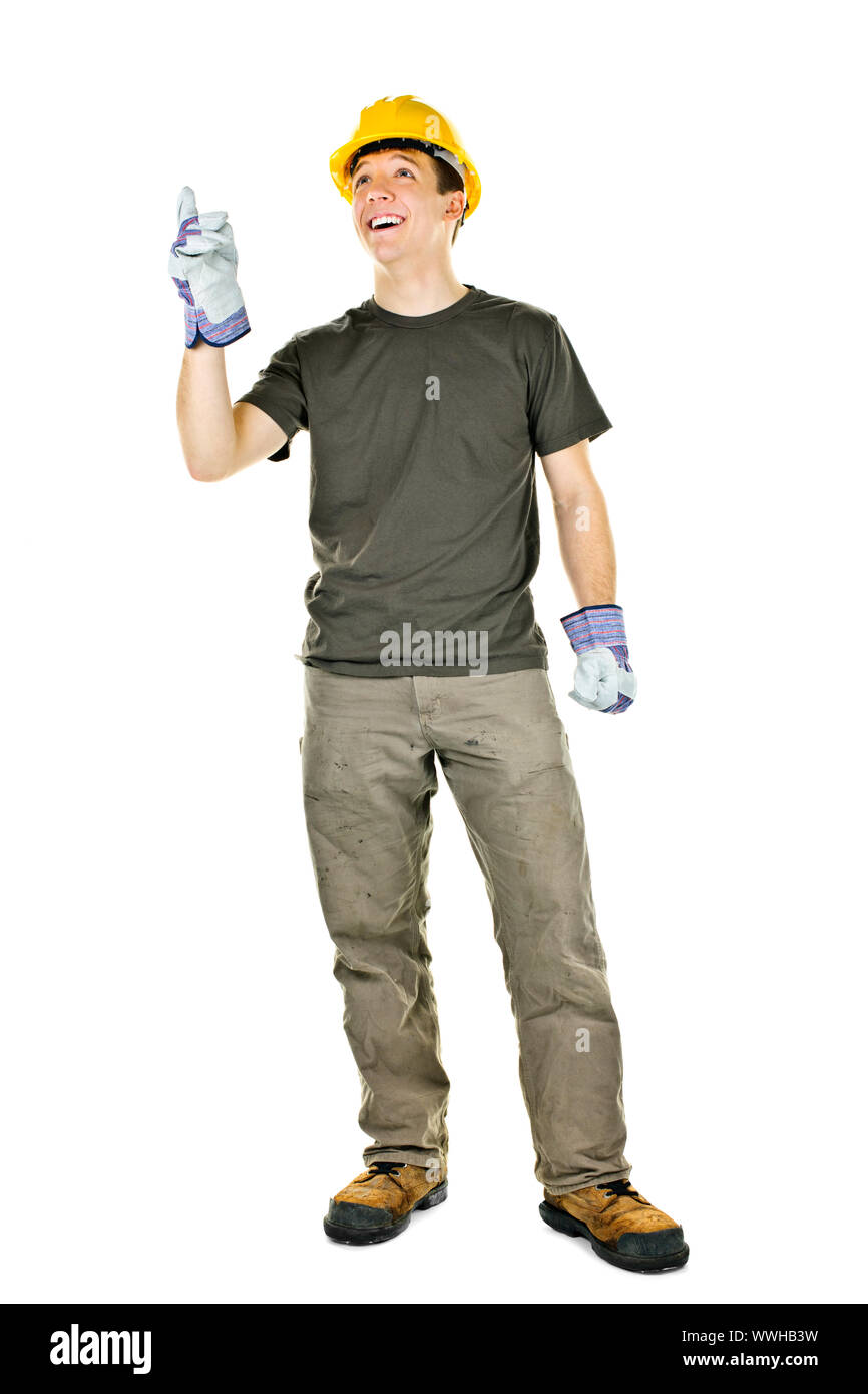 Smiling construction worker pointing up standing isolated on white ...