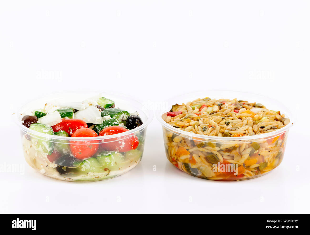 Two servings of prepared salad in plastic takeaway containers Stock ...
