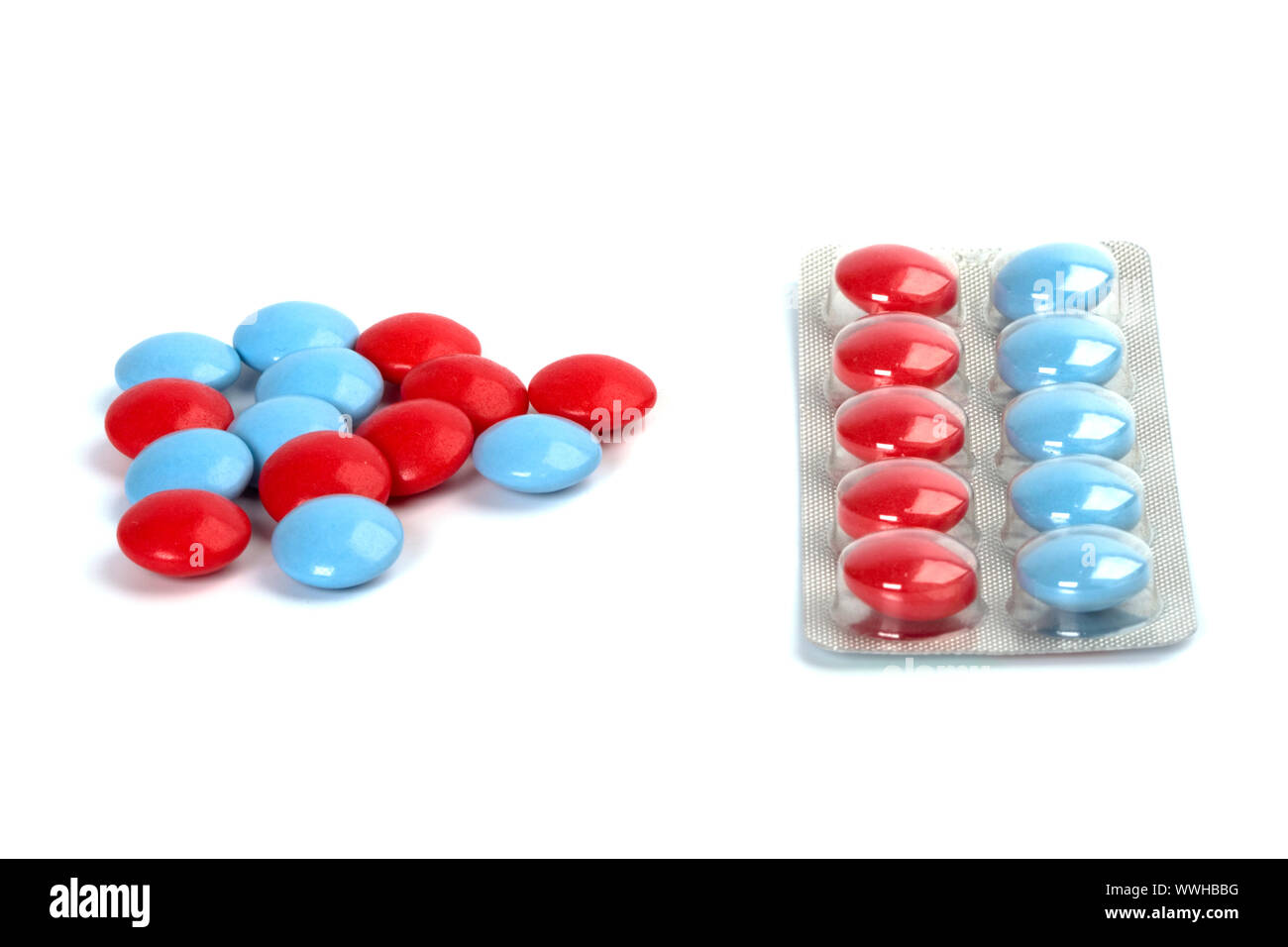 red and blue pills in plastic blister isolated on white background ...
