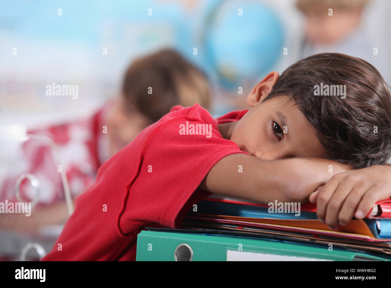 sleepy boy in classroom Stock Photo - Alamy