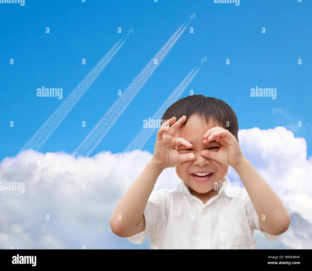 happy boy watching airplane flying through the sky over the cloud Stock ...