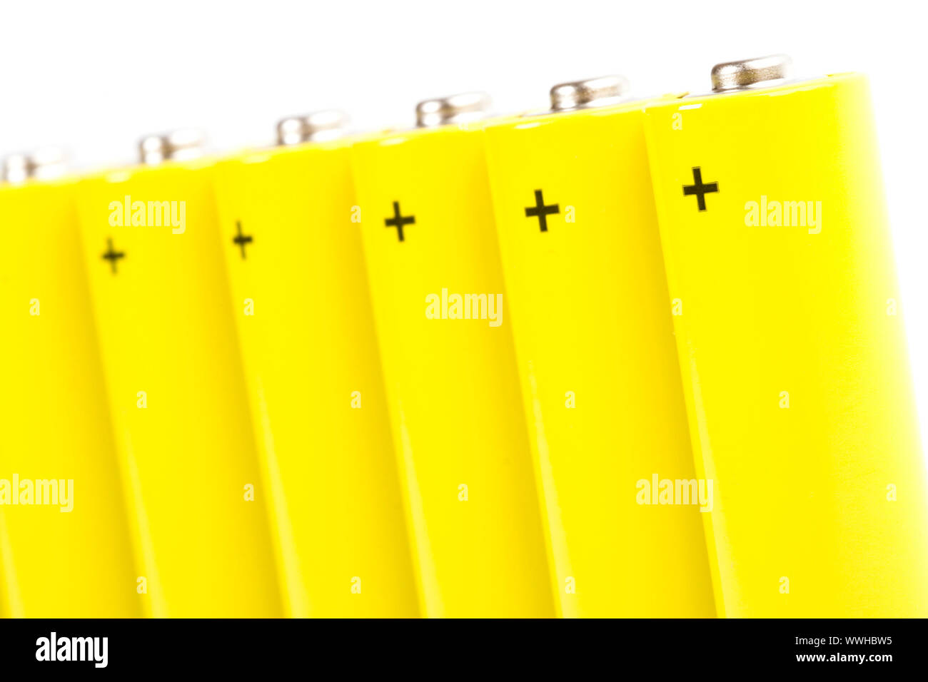 yellow alkaline batteries closeup on white background Stock Photo - Alamy