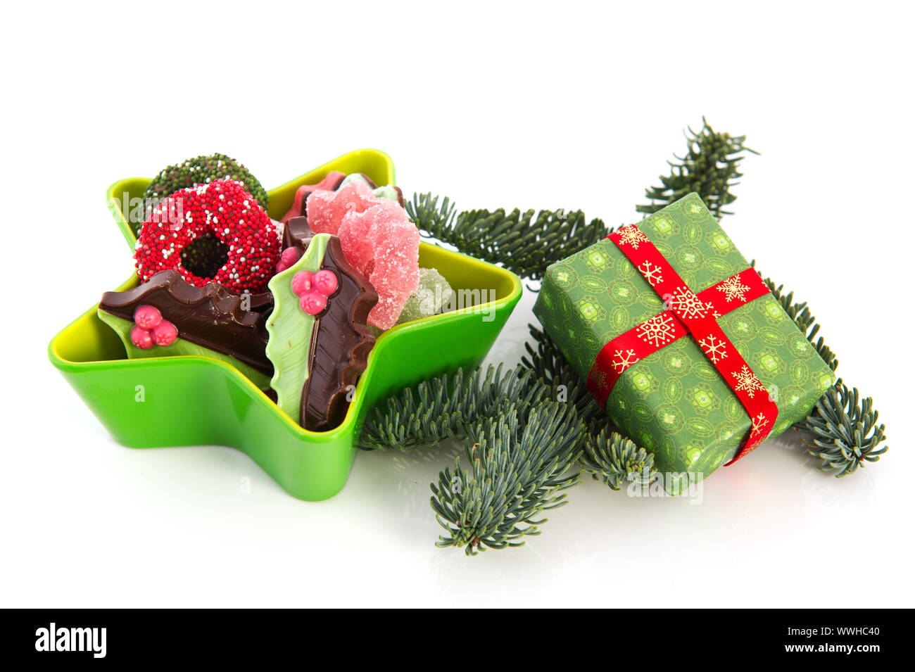 Green star full with christmas chocolate and present Stock Photo - Alamy