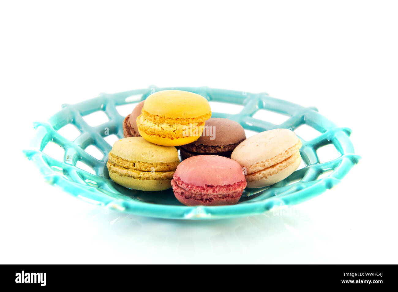Blue plate with French Macarons isolated over white background Stock ...
