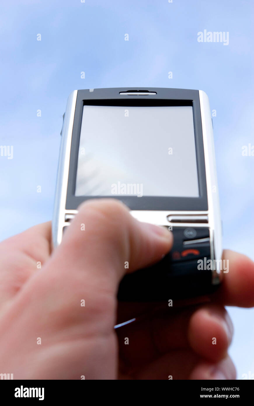a hand holding a mobile phone for support Stock Photo - Alamy