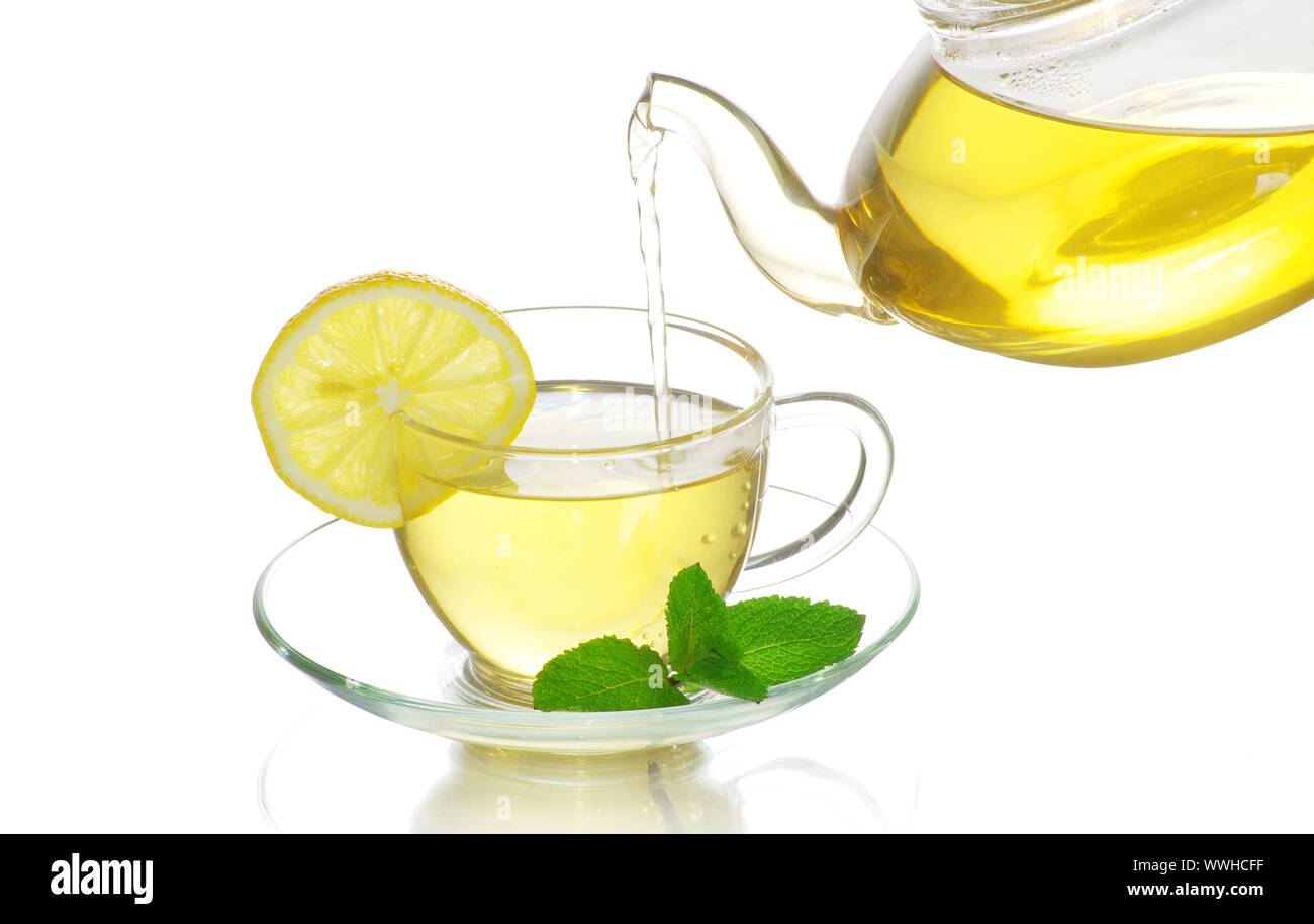 tea being poured into glass tea cup Stock Photo - Alamy