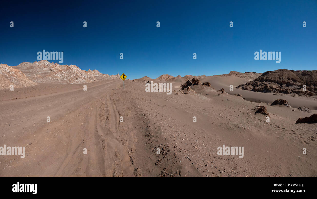 Curved road signal in the sand desert Stock Photo - Alamy