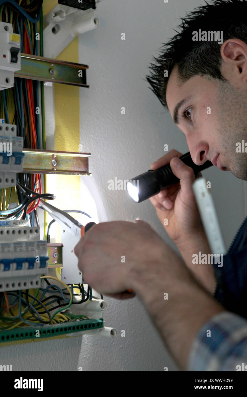 Man repairing electrical panel Stock Photo - Alamy