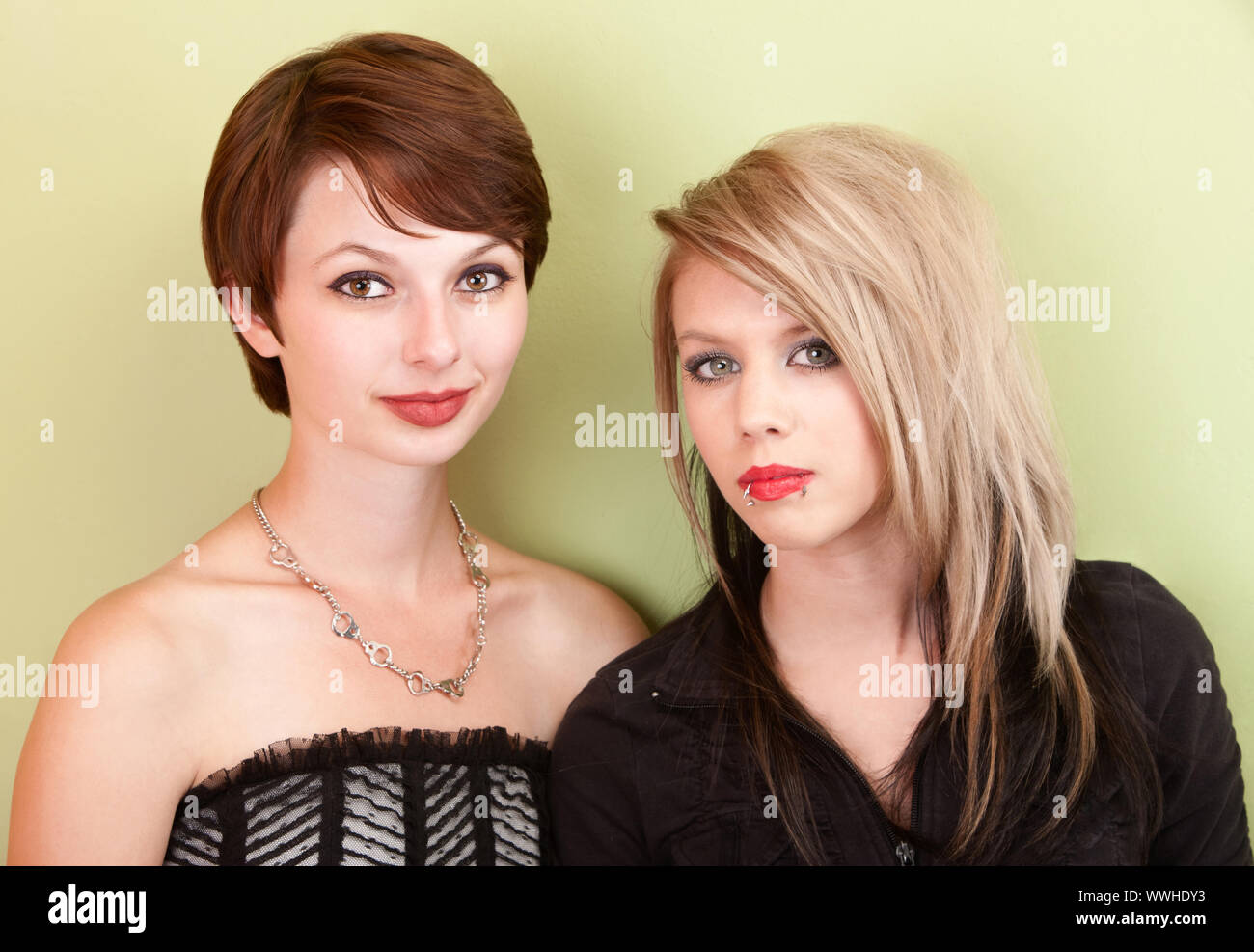Two young punk girls stare seriously at the camera Stock Photo - Alamy