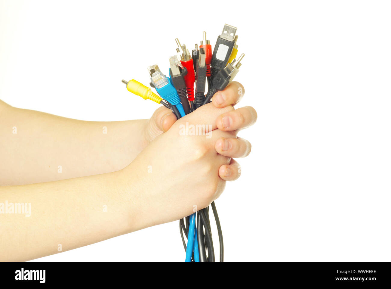 Computer cables in hand isolated on white background Stock Photo - Alamy
