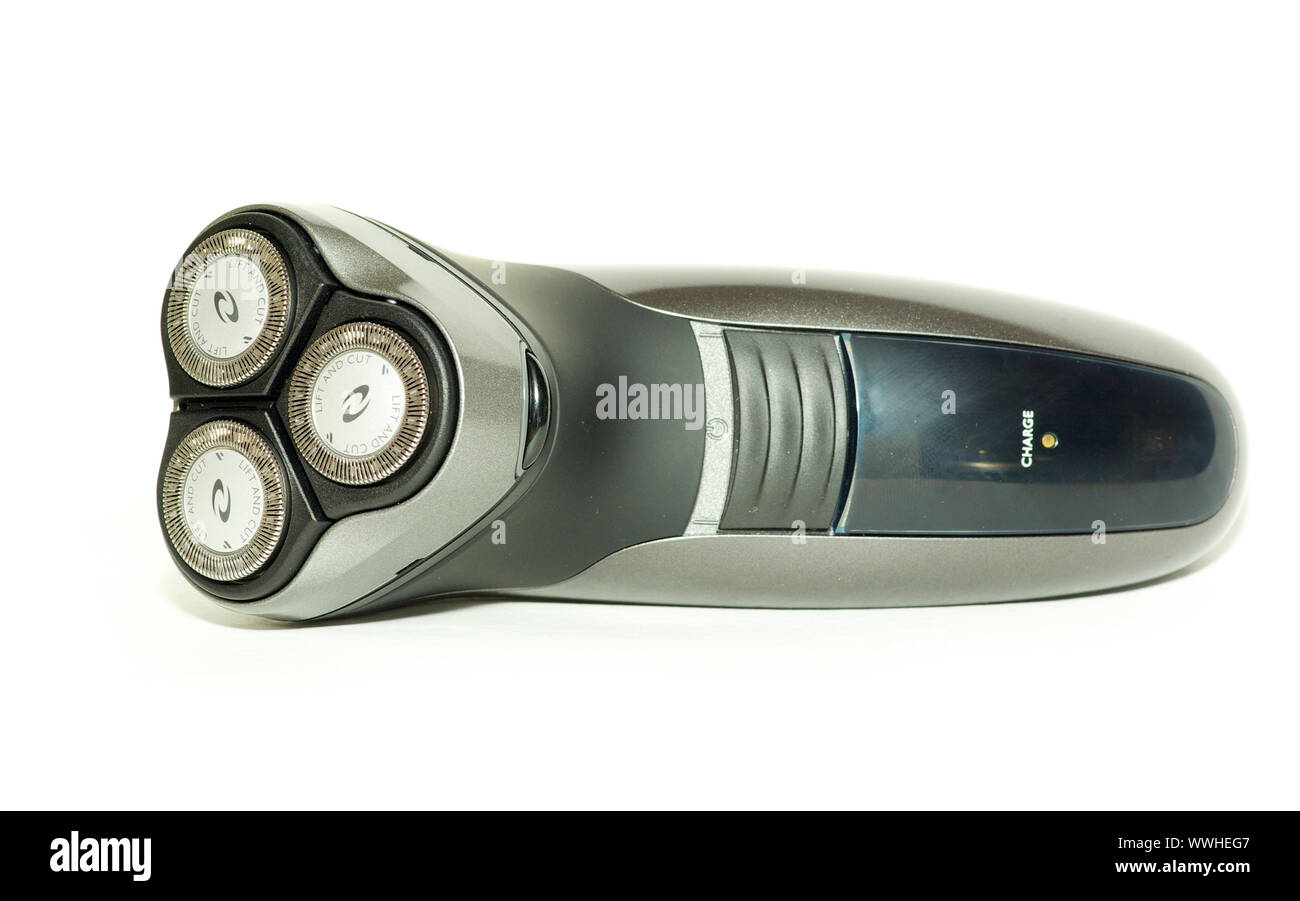 Close up on an electric razor laying sideways Stock Photo - Alamy