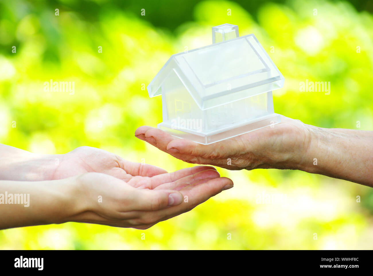 The house in human hand Stock Photo - Alamy