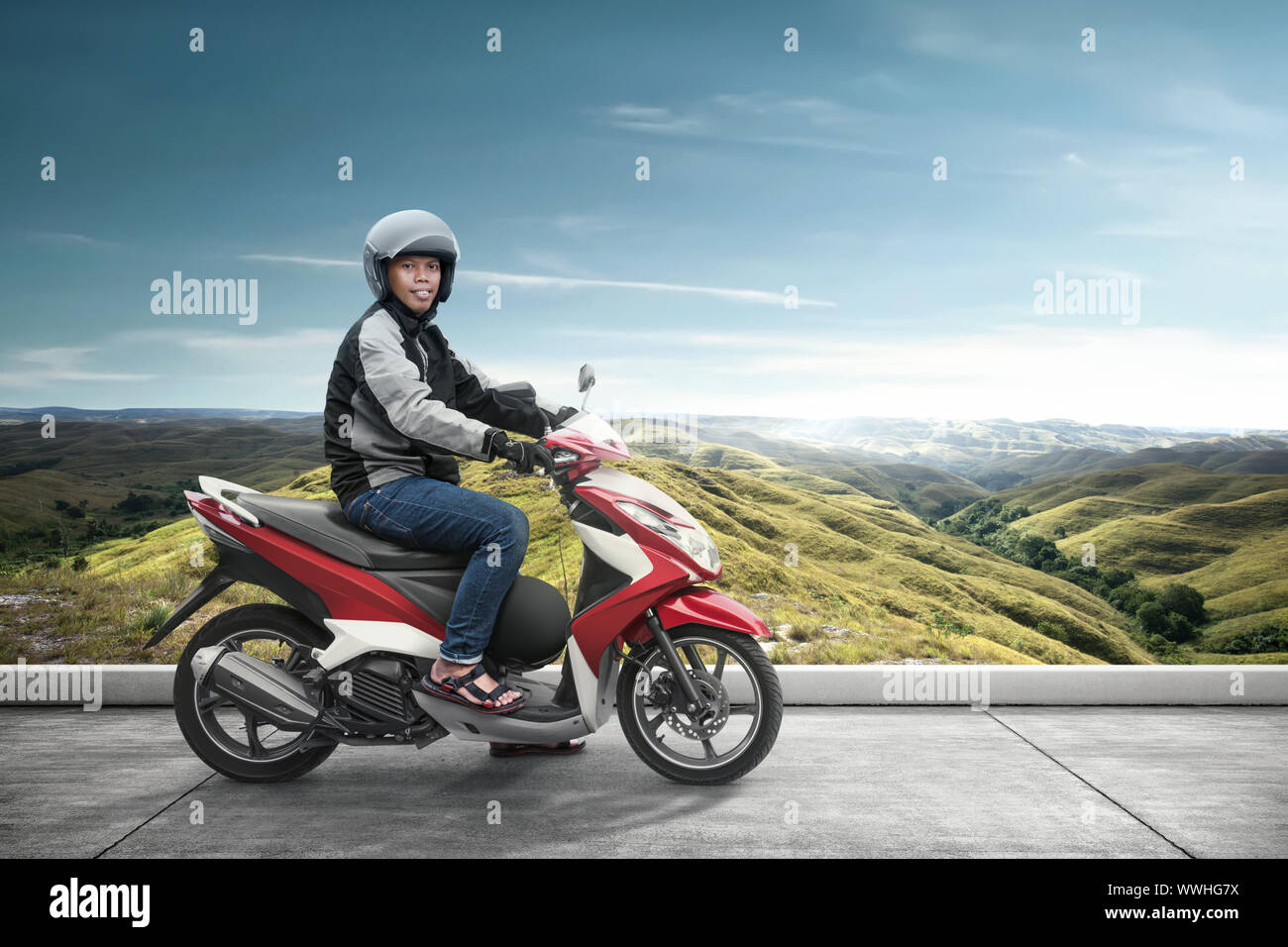 Asian motorcycle taxi man with his motorcycle on the asphalt road Stock ...