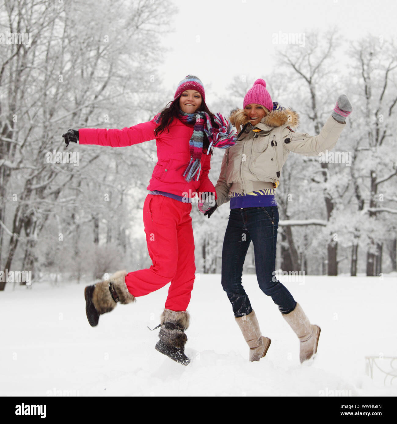 winter girl jump on snow background Stock Photo - Alamy