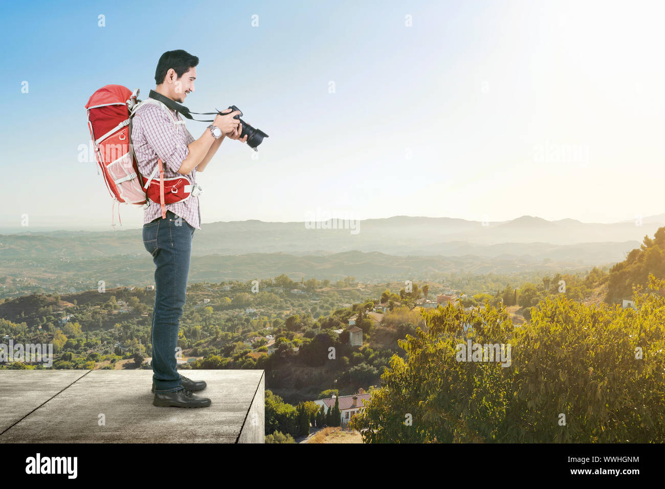 Asian traveler holding camera backpack hi-res stock photography and ...