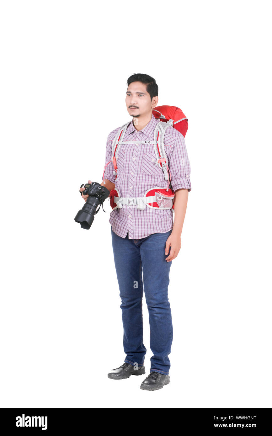 Asian man with a backpack holding a camera to take pictures isolated ...