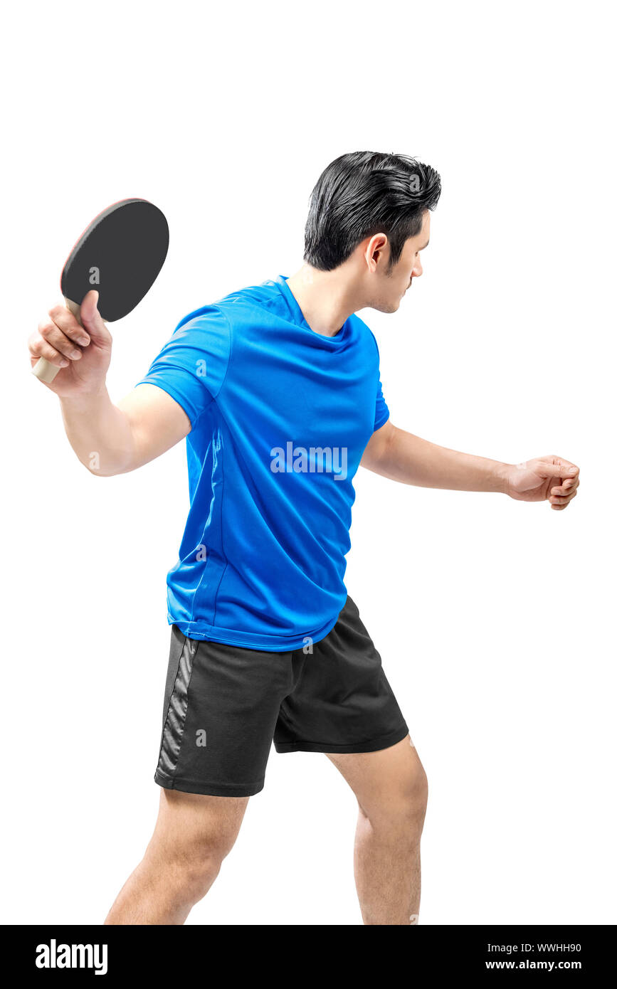 Asian table tennis player swings the racket posing isolated over white ...