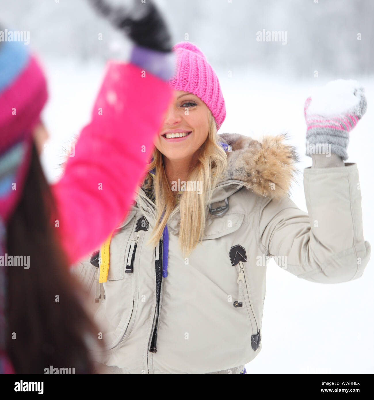 winter woman play snowballs on snow background Stock Photo - Alamy