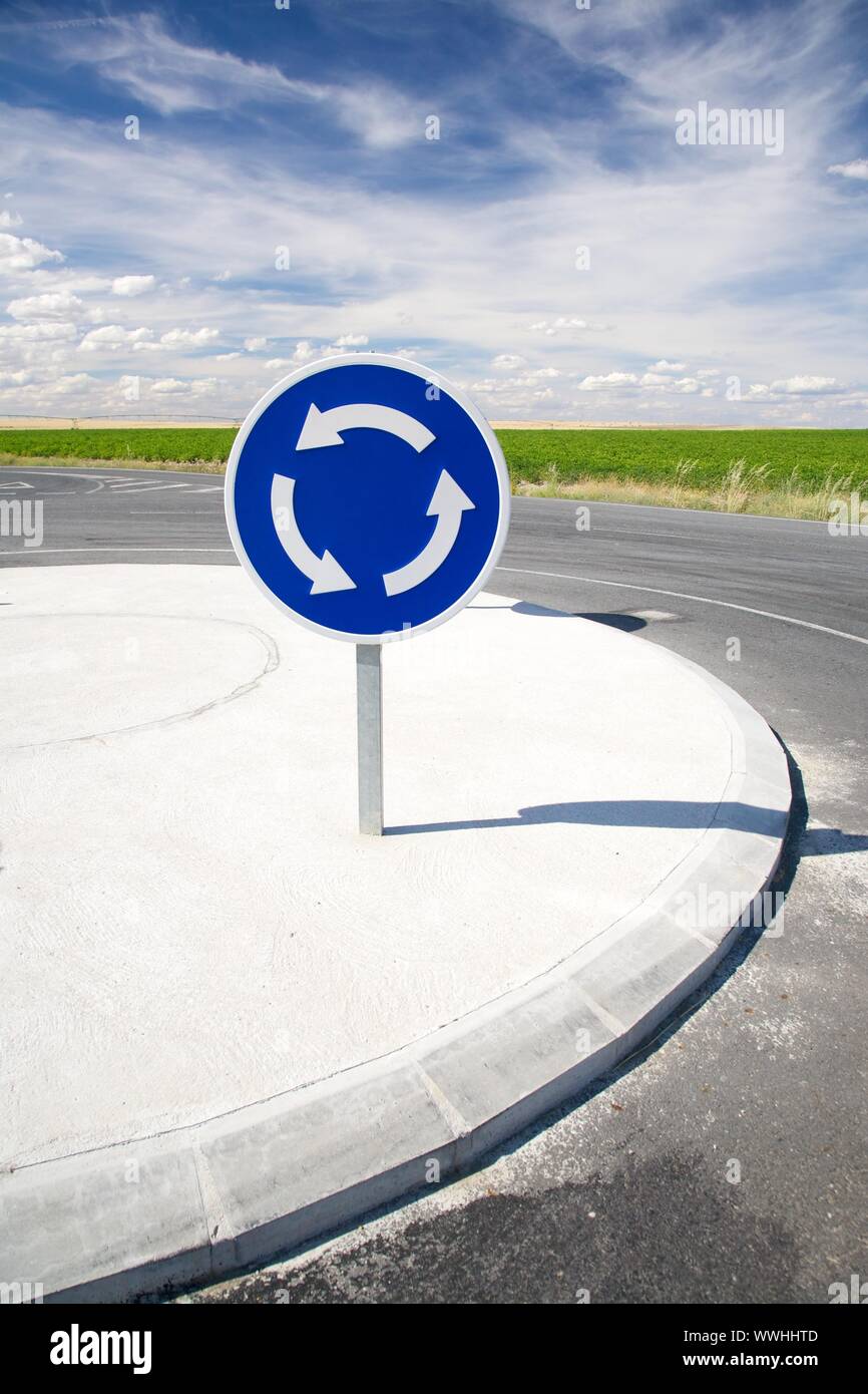 roundabout blue signal in a road at Arevalo Spain Stock Photo - Alamy