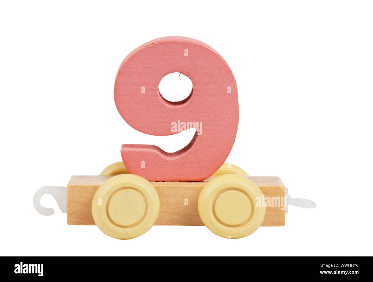 Wooden toy on a wheels number 9 isolated over white Stock Photo - Alamy