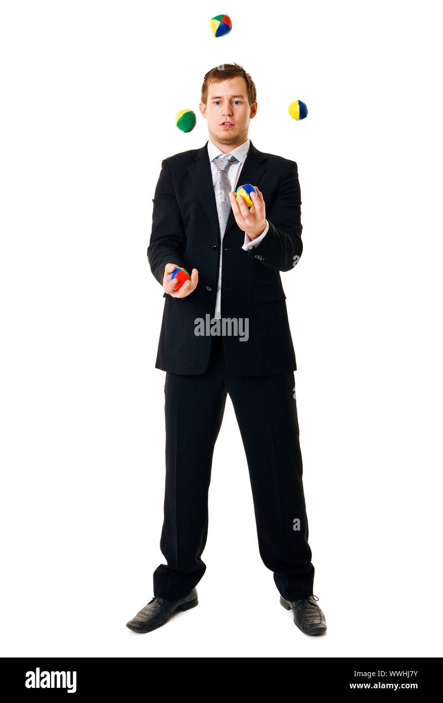 Juggling businessman isolated on white background Stock Photo - Alamy