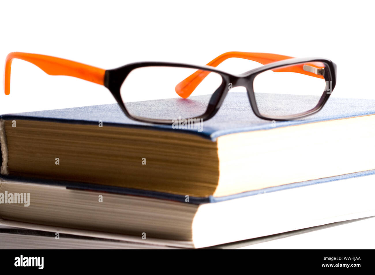 books and glasses closeup on white background Stock Photo - Alamy
