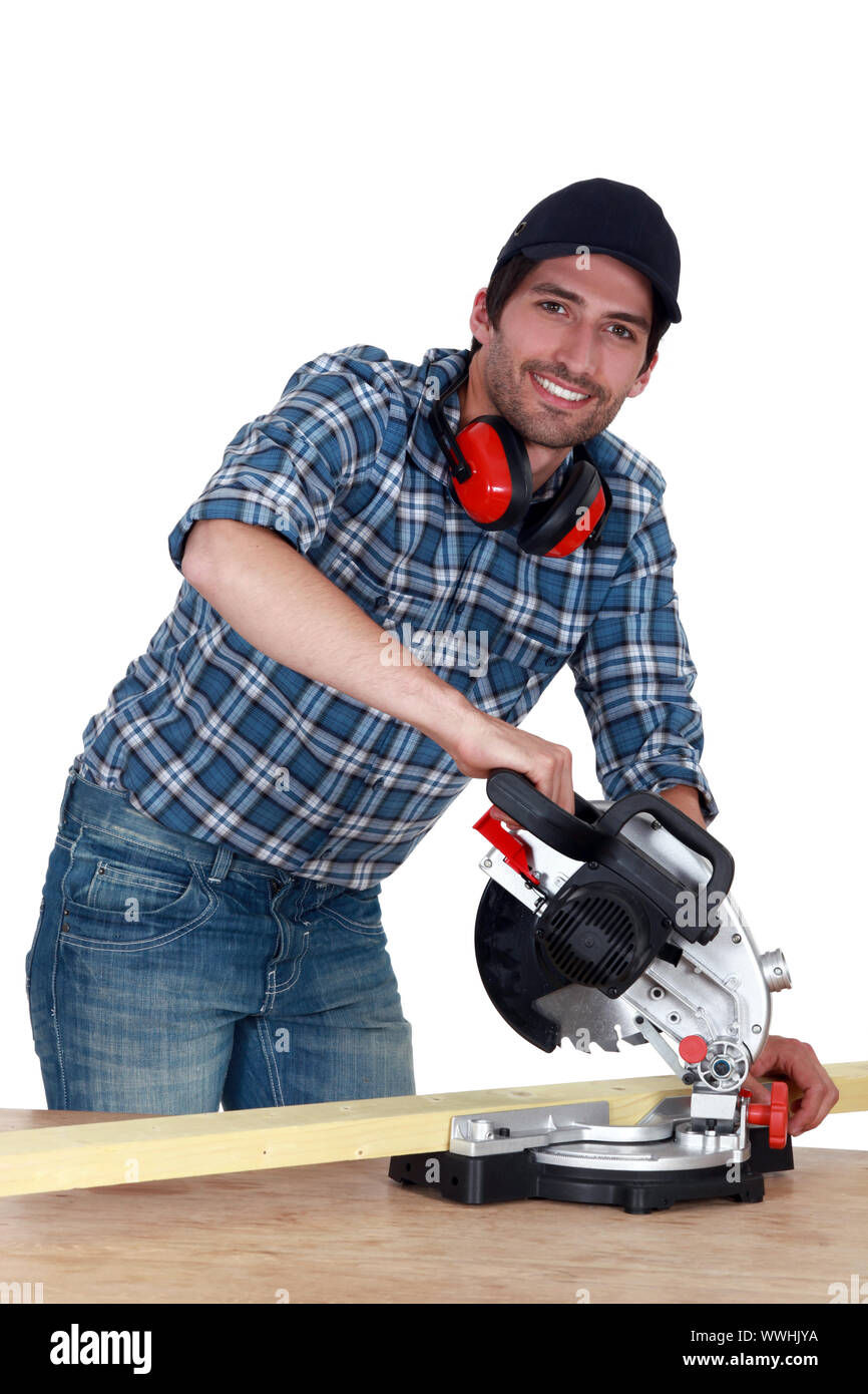 A carpenter with a circular saw Stock Photo - Alamy