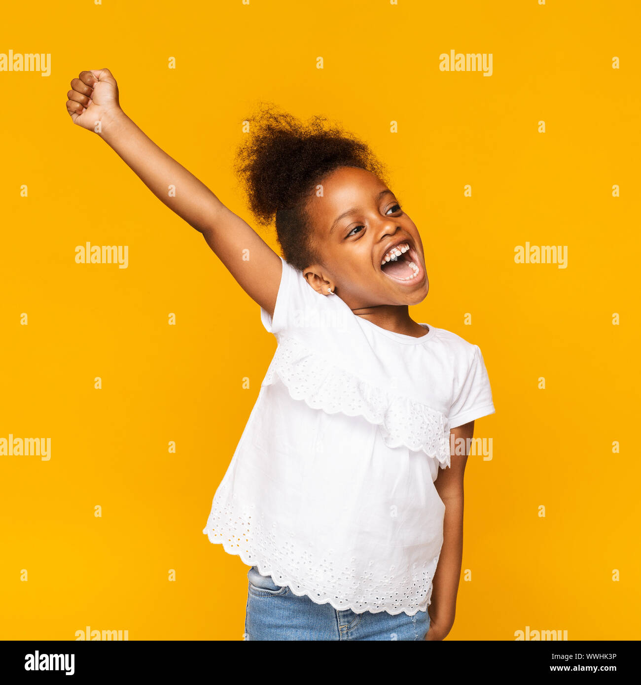 Cute african toddler girl shouting hooray on orange background Stock ...