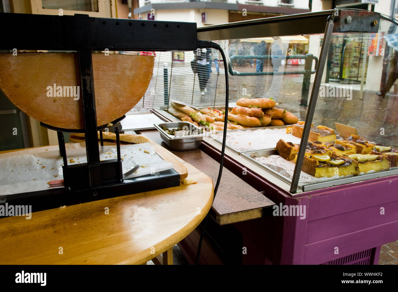 Street buffet with Raclette cheese grill at town of Annecy in the Haute ...