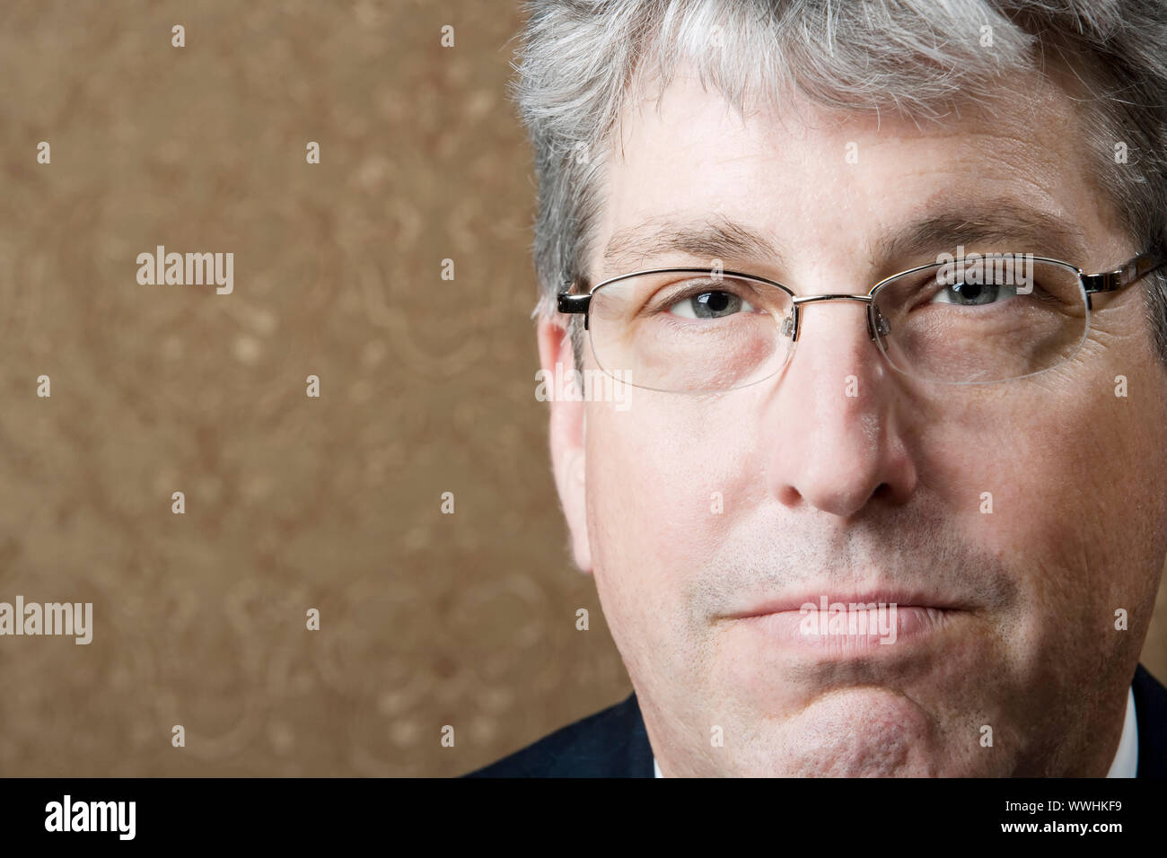 Corporate executive in front of a gold background Stock Photo - Alamy