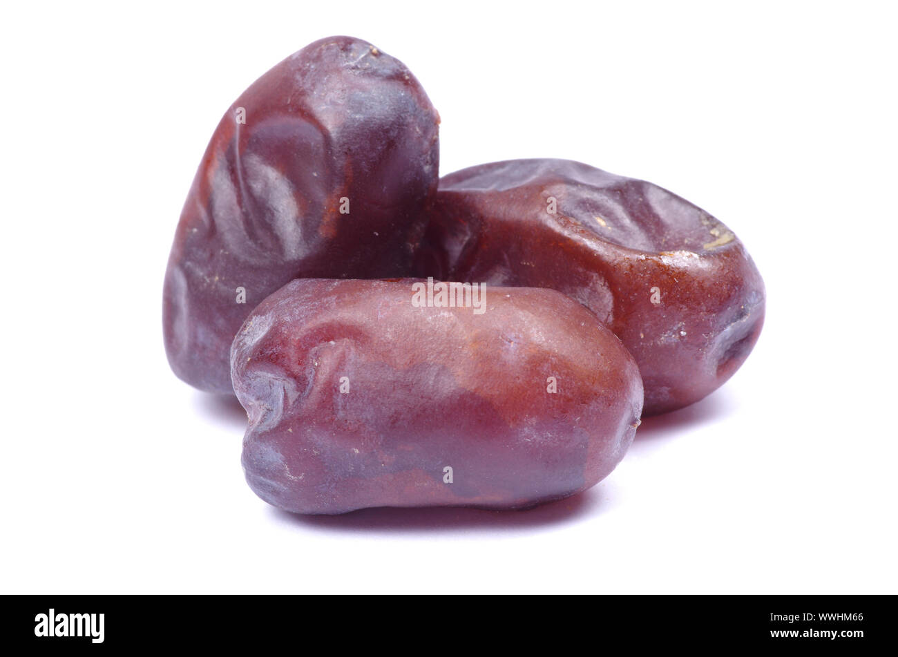 dryed dates on white background Stock Photo - Alamy