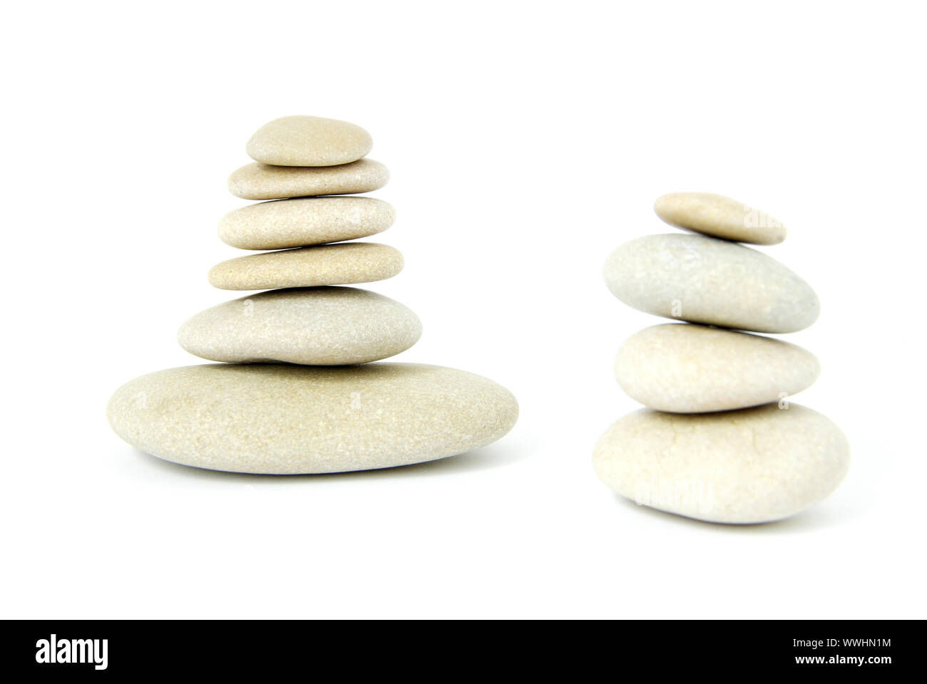 Stack of balanced stones on a white background Stock Photo - Alamy