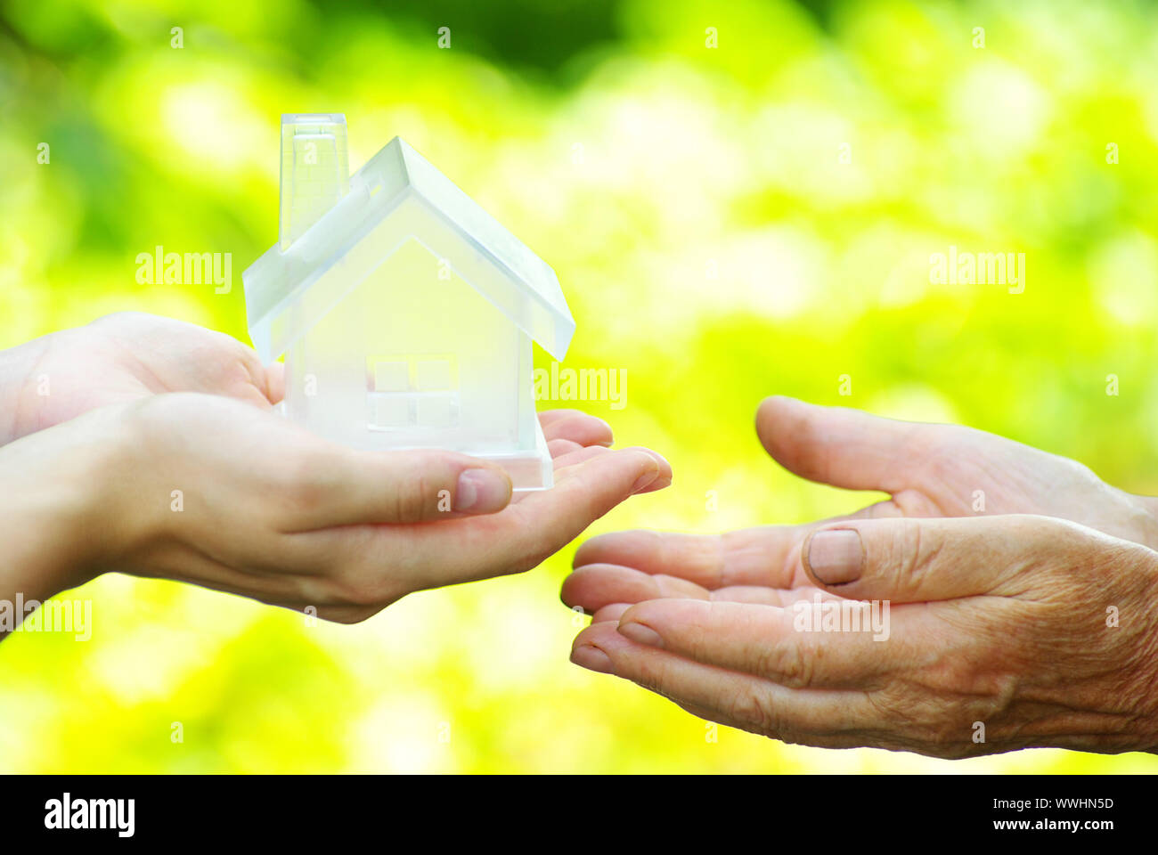 The house in human hand Stock Photo - Alamy