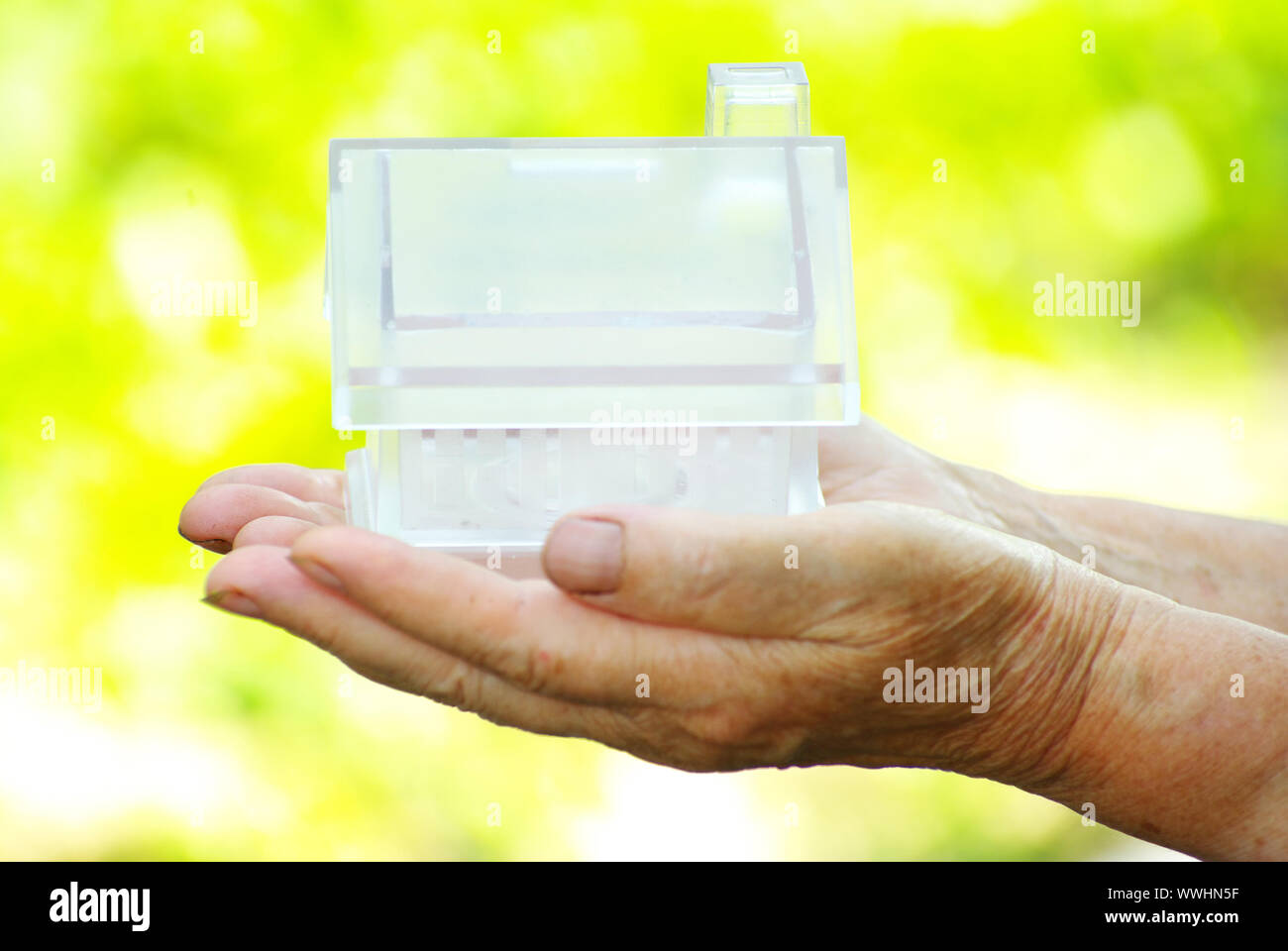 The house in human hand Stock Photo - Alamy